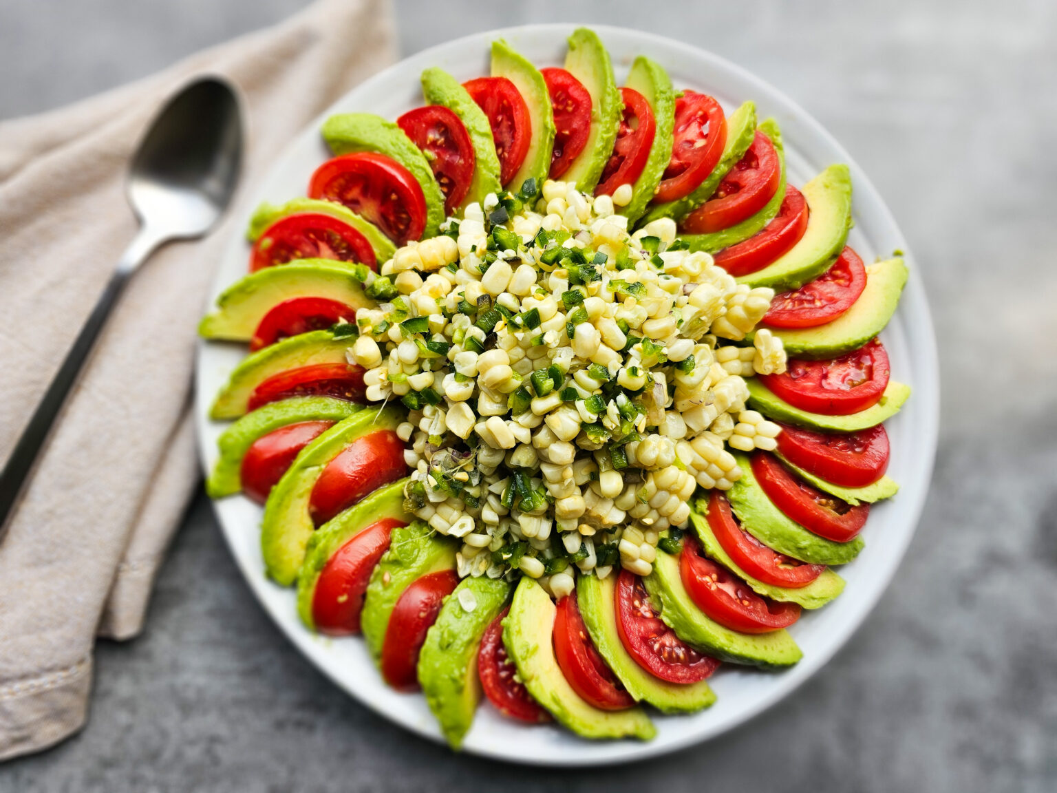 Tomato Avocado and Corn Salad - Women of Today