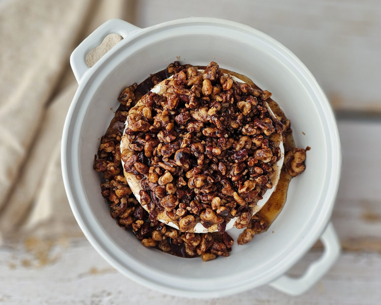 Baked Brie with Toasted Nuts, Cinnamon, and Maple Syrup - Women of Today